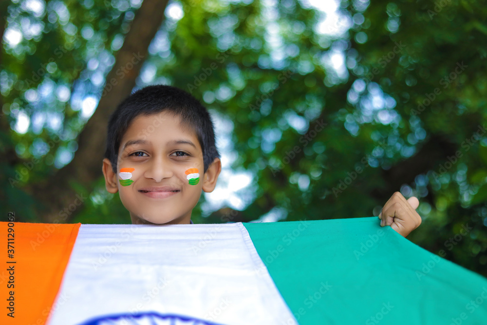young indian child with indian flag on face Stock Photo | Adobe Stock