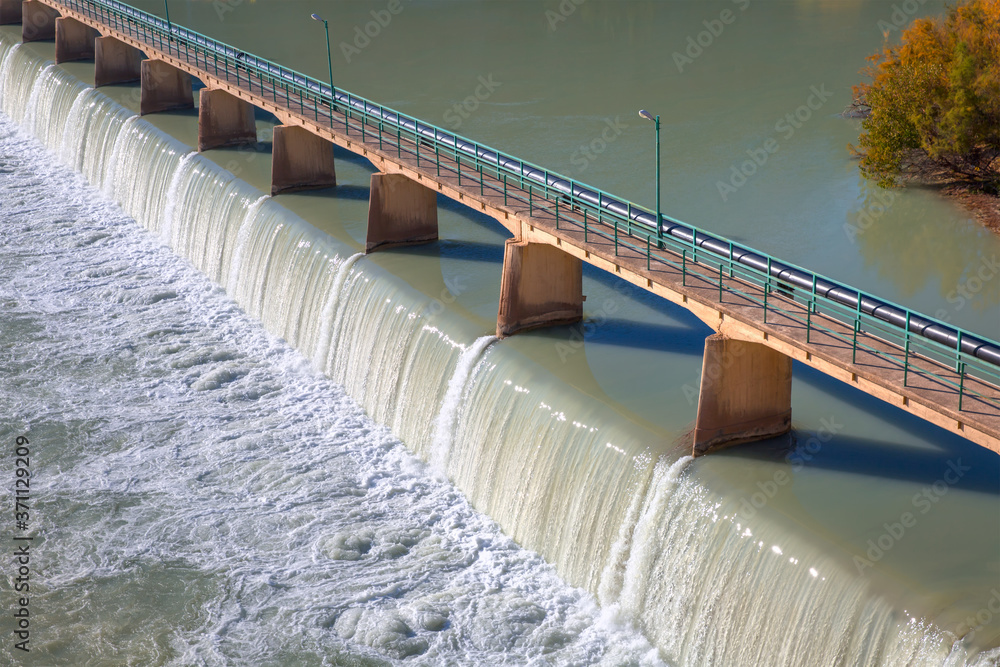 Water spills over the top of Silifke Dam on the Goksu River Stock Photo ...