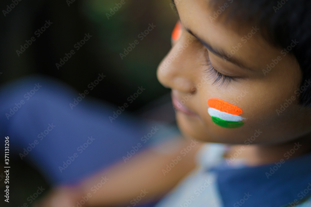 young indian child with indian flag on face Stock Photo | Adobe Stock