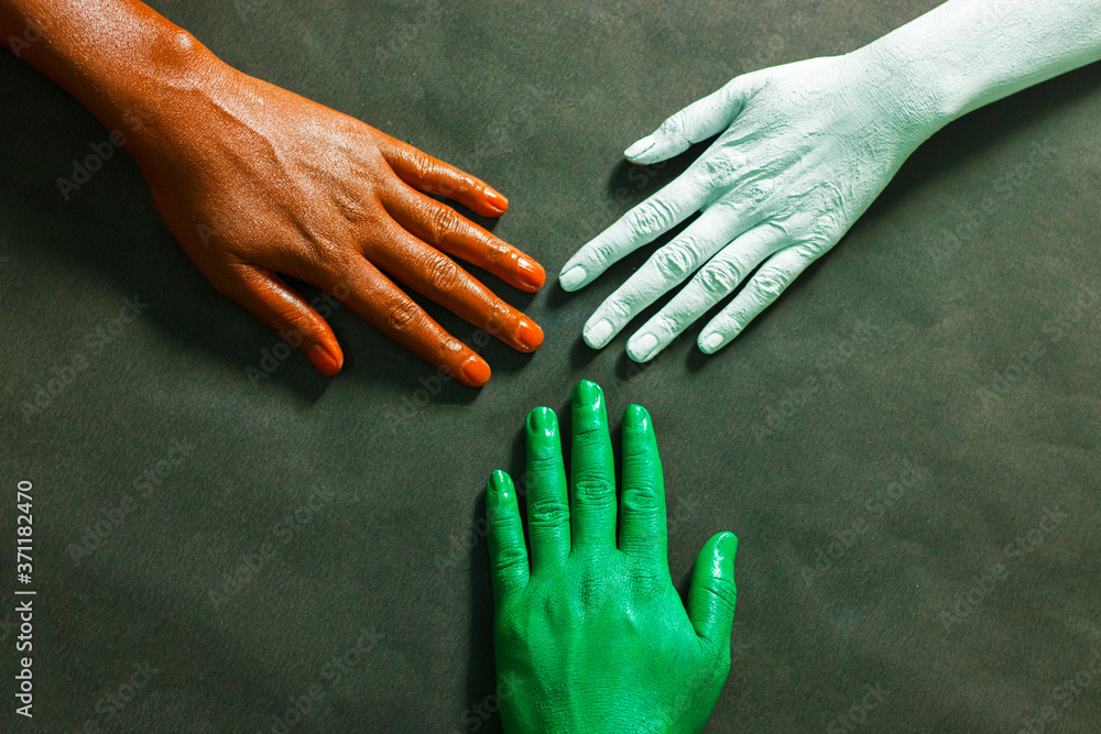three hands are painted with three colors,saffron,white and green to ...
