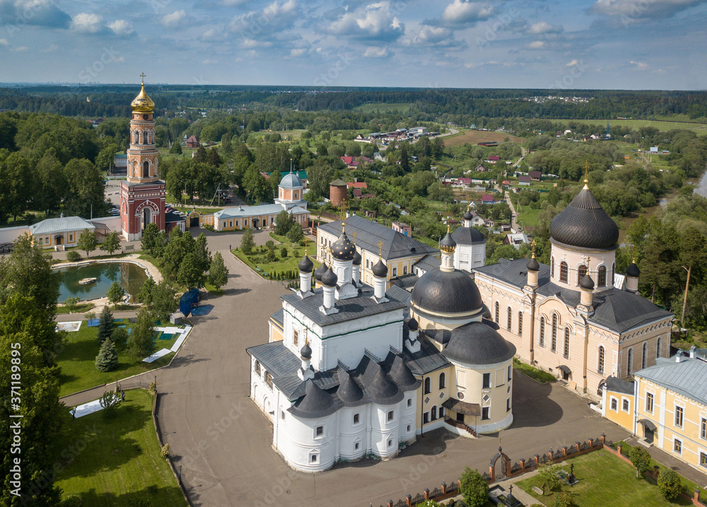 Aerial summer view of white old monastery with golden domes in Russia ...