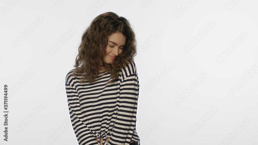 Portrait of shy woman on white background. Shy girl in studio. Young ...