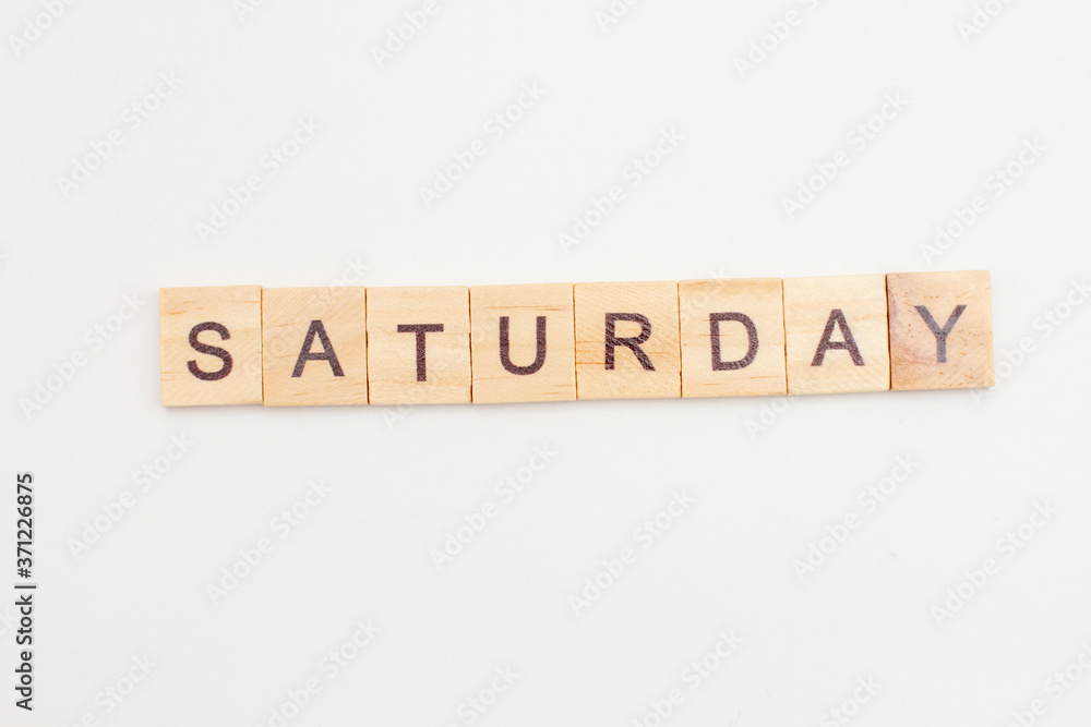 Word SATURDAY made from wooden cubes on white. Days of the week Stock ...