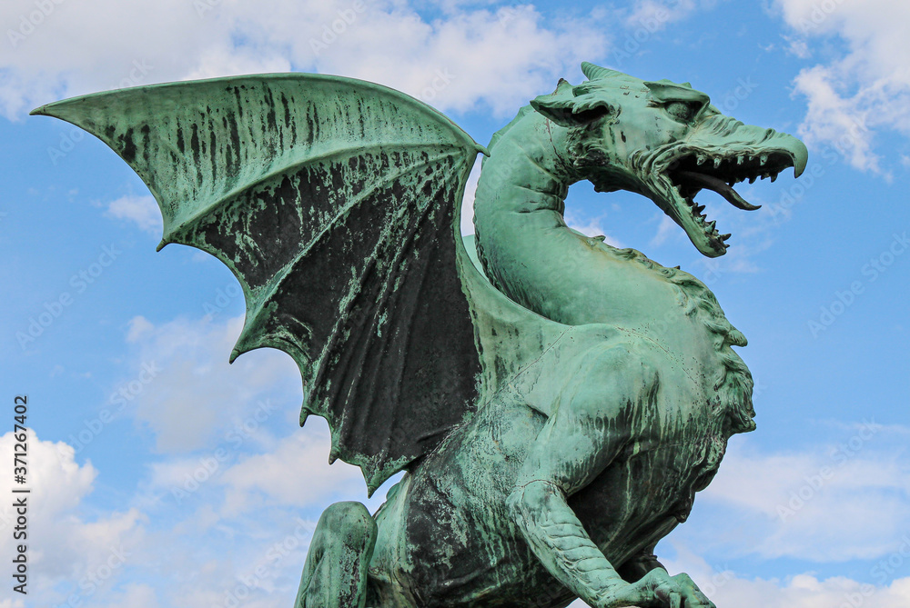 The Dragon statue at Dragon Bridge in old Medieval Ljubljana, Slovenia ...