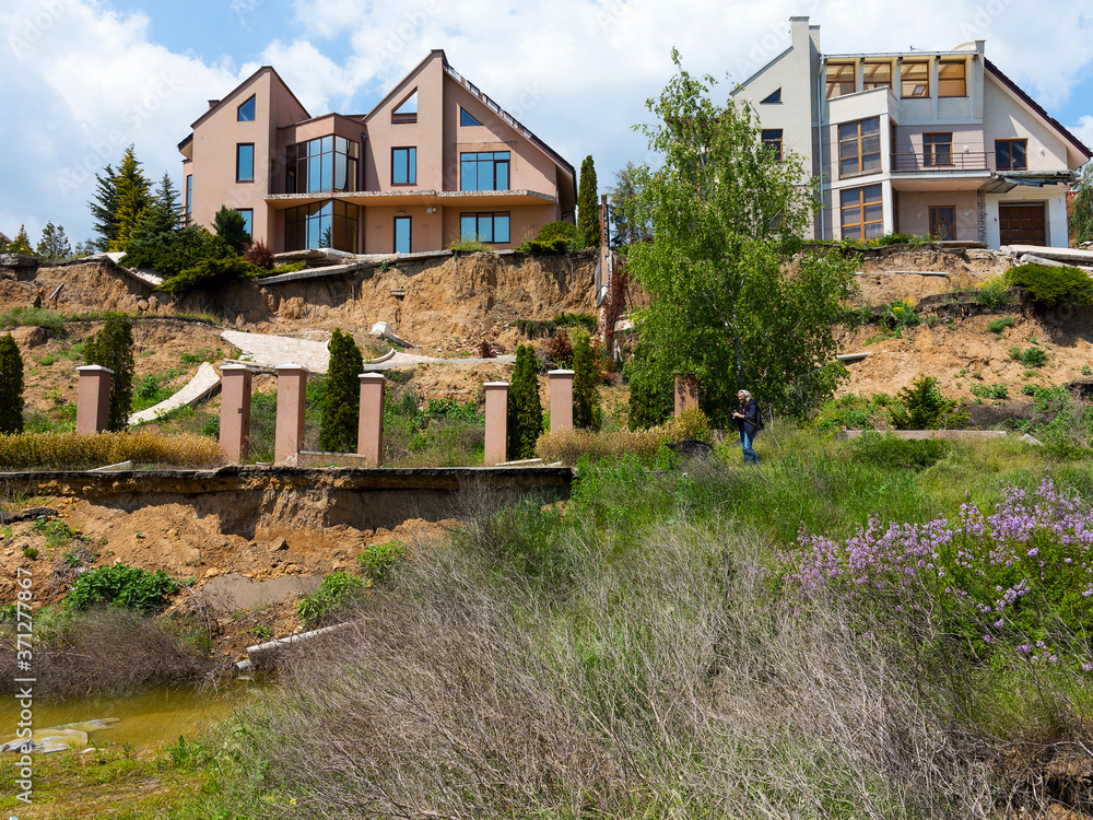 landslide caused by torrential rains of hurricane CHRISTIE. Broken road ...
