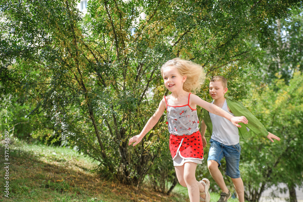 children playing imagining themselves as planes Stock Photo | Adobe Stock