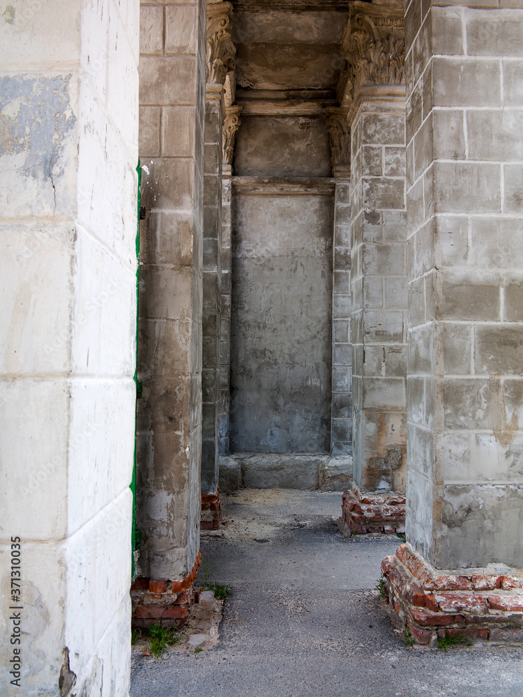 Old crumbling columns of buildings constructed in Soviet period in ...