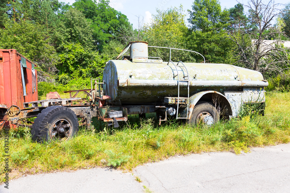 Radioactive dead zone of Chernobyl. Abandoned looted appliances, cars ...