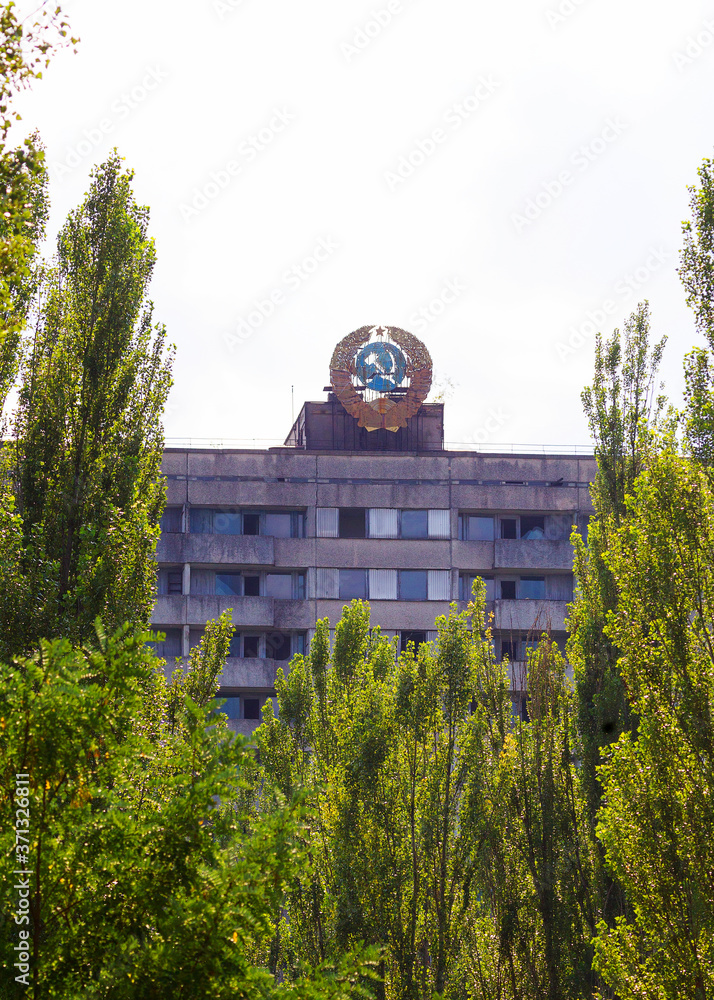Emblem of USSR on roof of building. Abandoned city Chernobyl ...