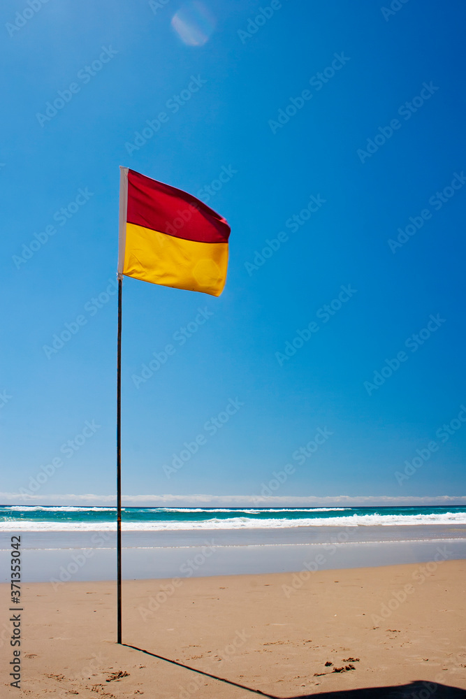 Lifesaving flag. Swimming flag on Australian beach Stock Photo | Adobe ...