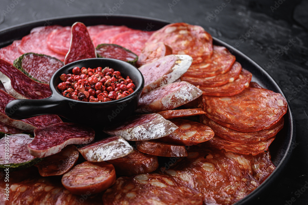 Cured meat platter of traditional spanish tapas. Chorizo, salchichon ...