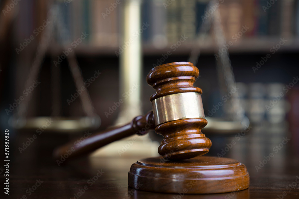 Law theme. Judge chamber. Gavel and scale on brown shining desk ...