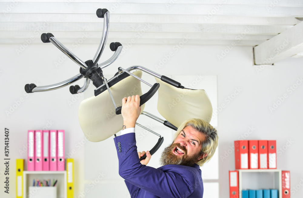 businessman ready to throw chair. angry entrepreneur in modern office ...