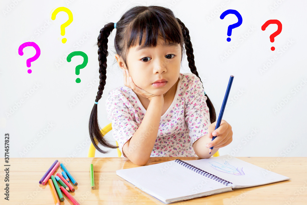 asian child has a problem of left hand , is drawing by pencil colors on ...