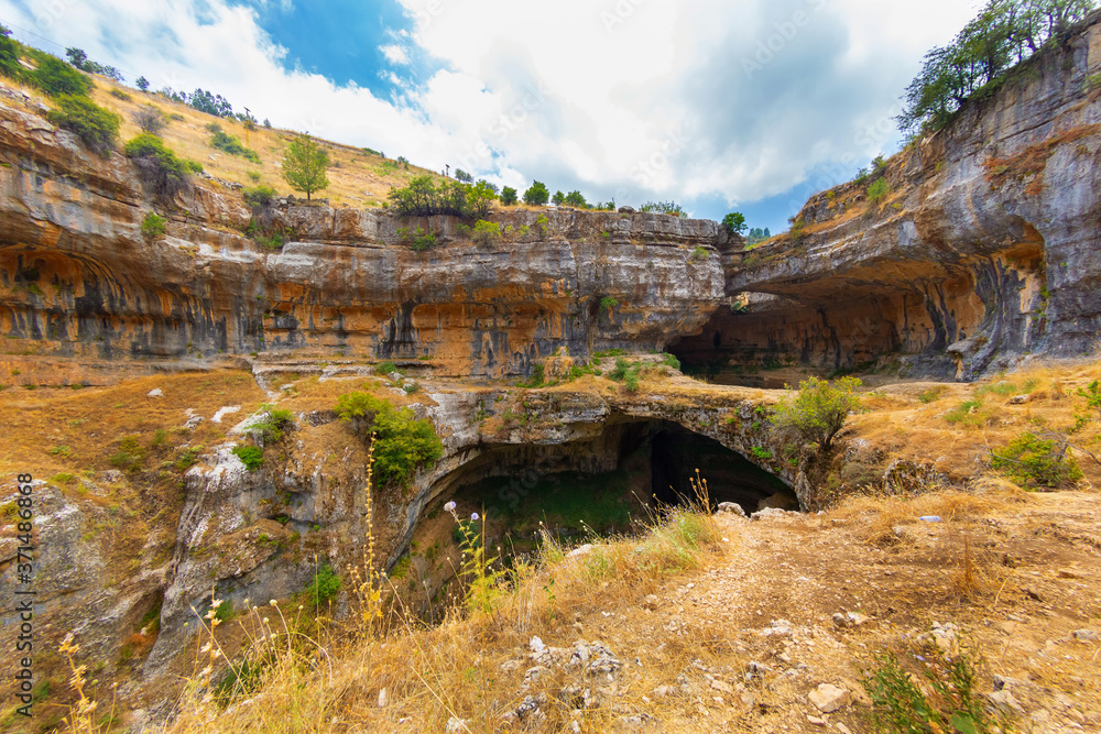 Baatara gorge waterfall in Lebanon. Balaa Sinkhole caves and formations ...