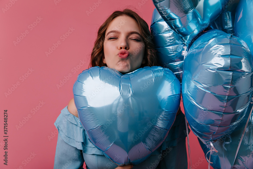 Fascinating birthday girl having fun at party. Refined european model ...