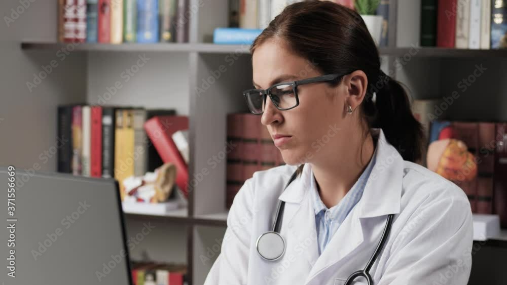 Tired sleepy doctor. Exhausted by work female doctor in office sits at ...