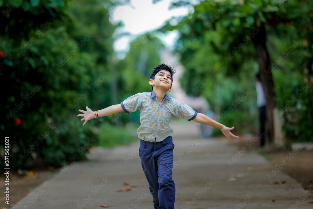 Indian School boy running at playground Stock Photo | Adobe Stock