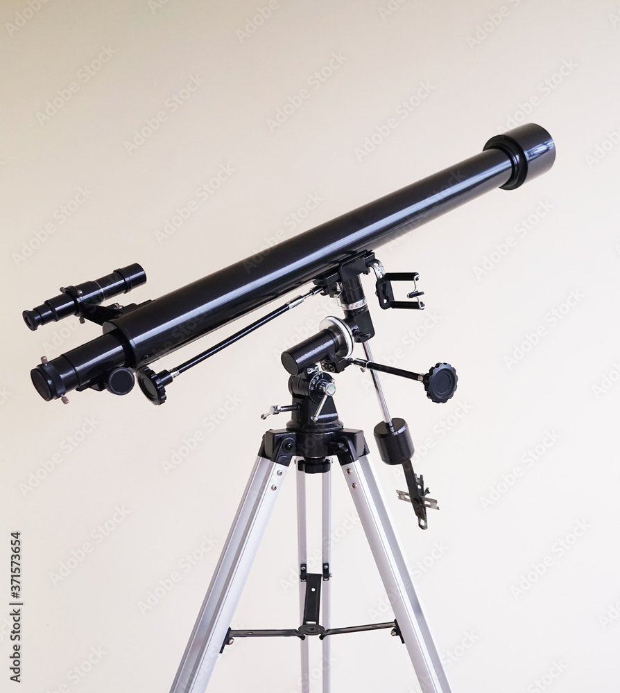 Telescope on a white wall background, Telescope on the equatorial ...