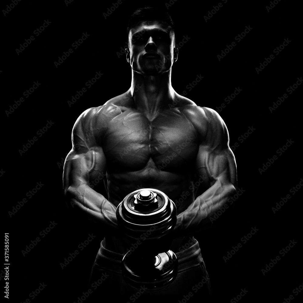 Silhouette of a bodybuilder. Power athletic man pumping up muscles with ...