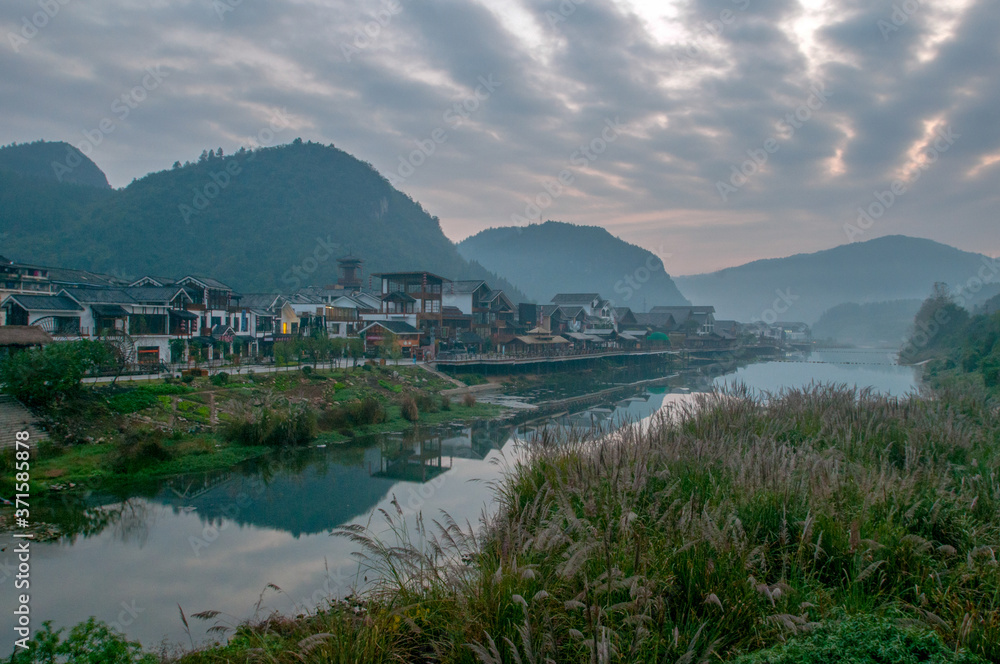 The sunrise scenery of Xibu Street in Zhangjiajie, Hunan province is ...