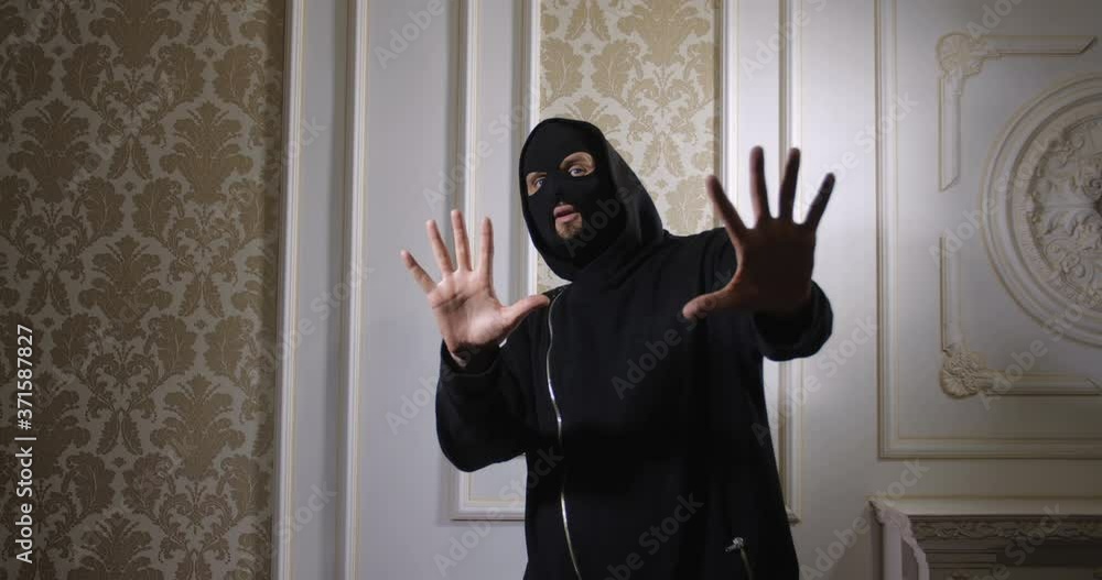 Robbery of the museum. Man in black clothes and balaclava is caught in ...