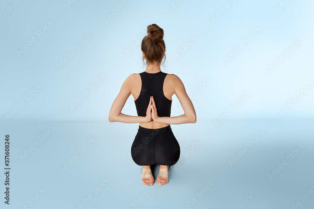 Yoga as a way to healthy and balanced life. Brown-haired lady in black ...