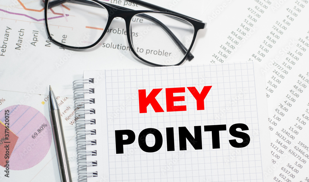 KEY POINTS on a table against the background of financial statements ...