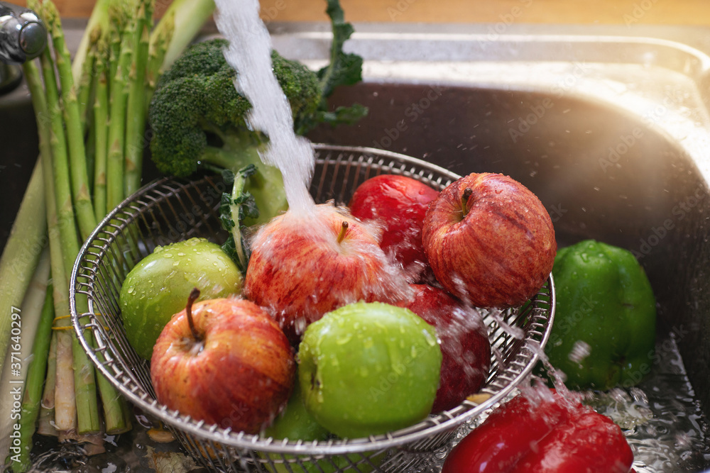Water flows on vegetables and fruits to get rid of pesticides before ...