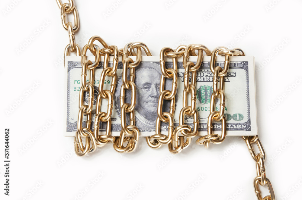 gold chain wrapped around a bundle of hundred-dollar bills, the concept ...