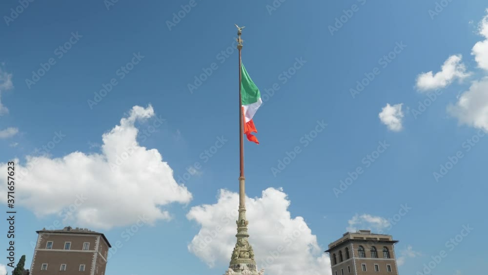 Italian flag waving in sunlight on blue sky background, tricolor ...