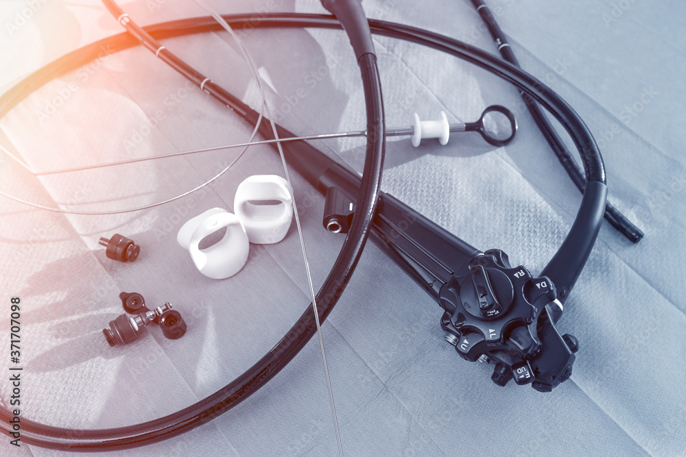 Medical instruments used in gastroscopy. Endoscope, mouthpiece and ...
