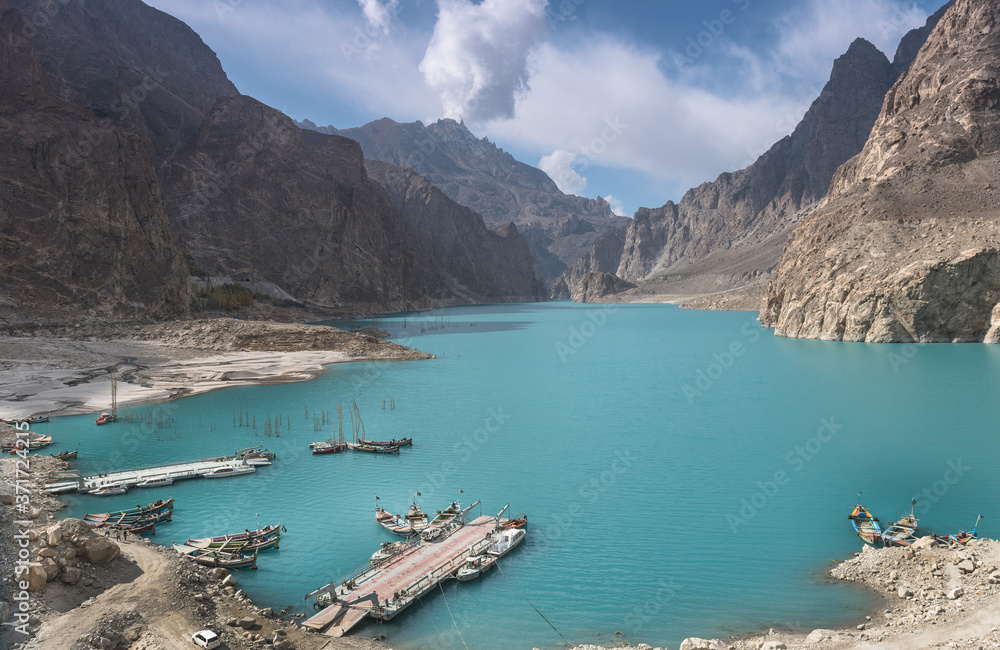 beautiful green water lake , boats and sky with clouds, Atabad lake ...