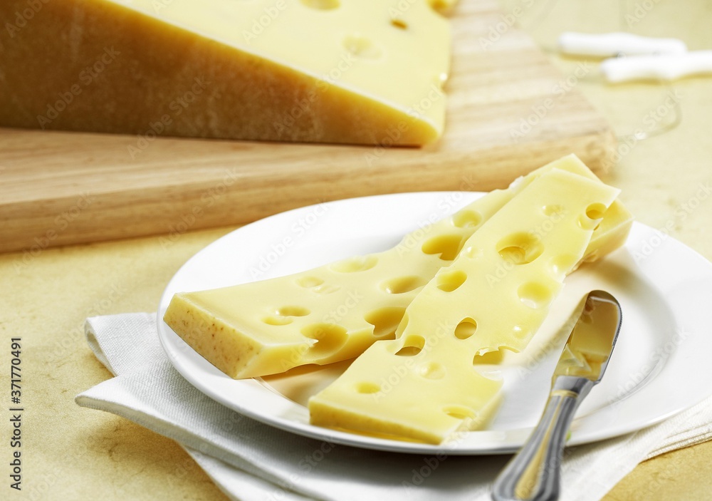Emmental, Swiss Cheese produced from Cow's Milk Stock Photo | Adobe Stock