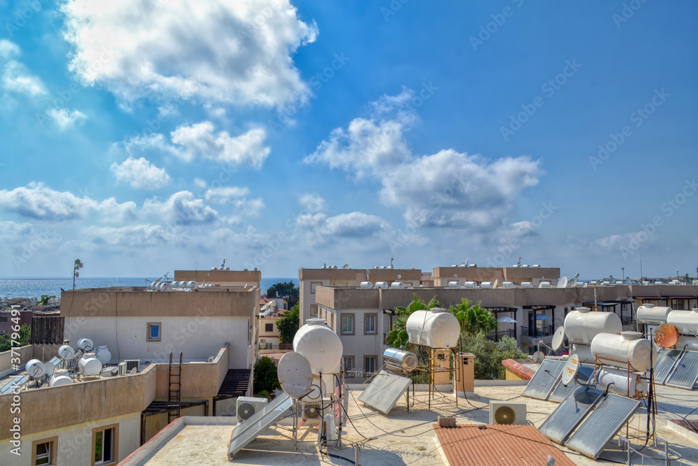 Water tanks located on the roofs of houses in the city of Paphos ...