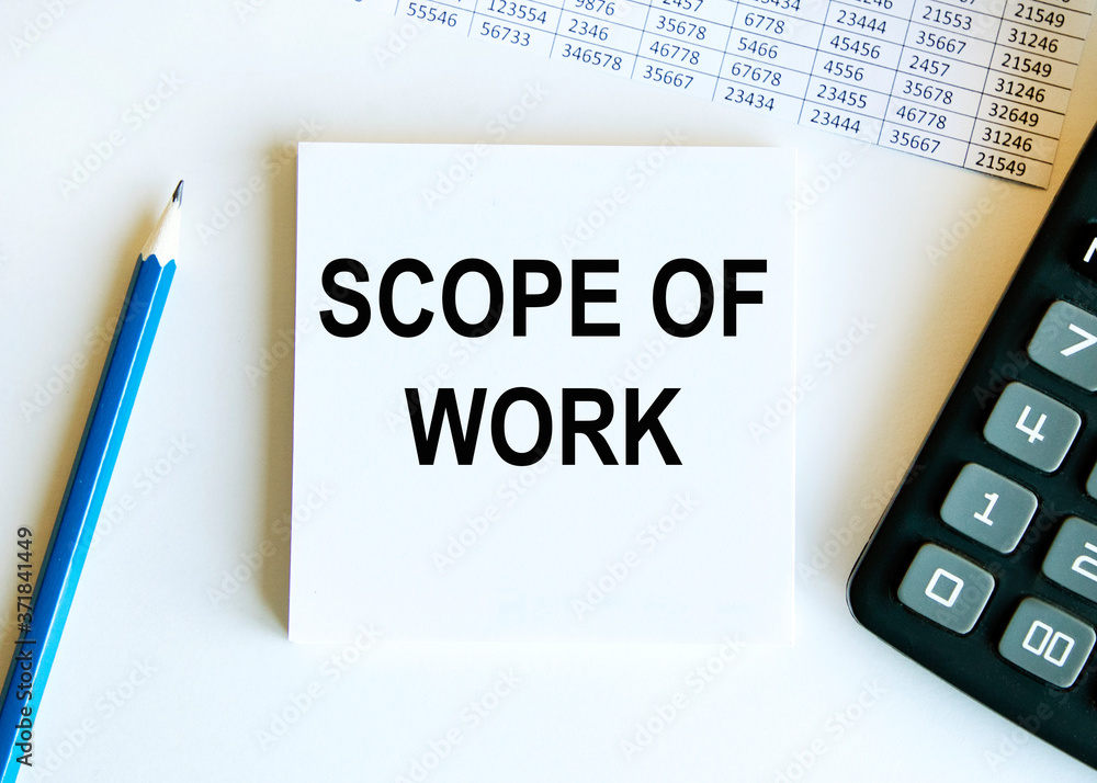 Scope of work. inscription on a white business card against the ...