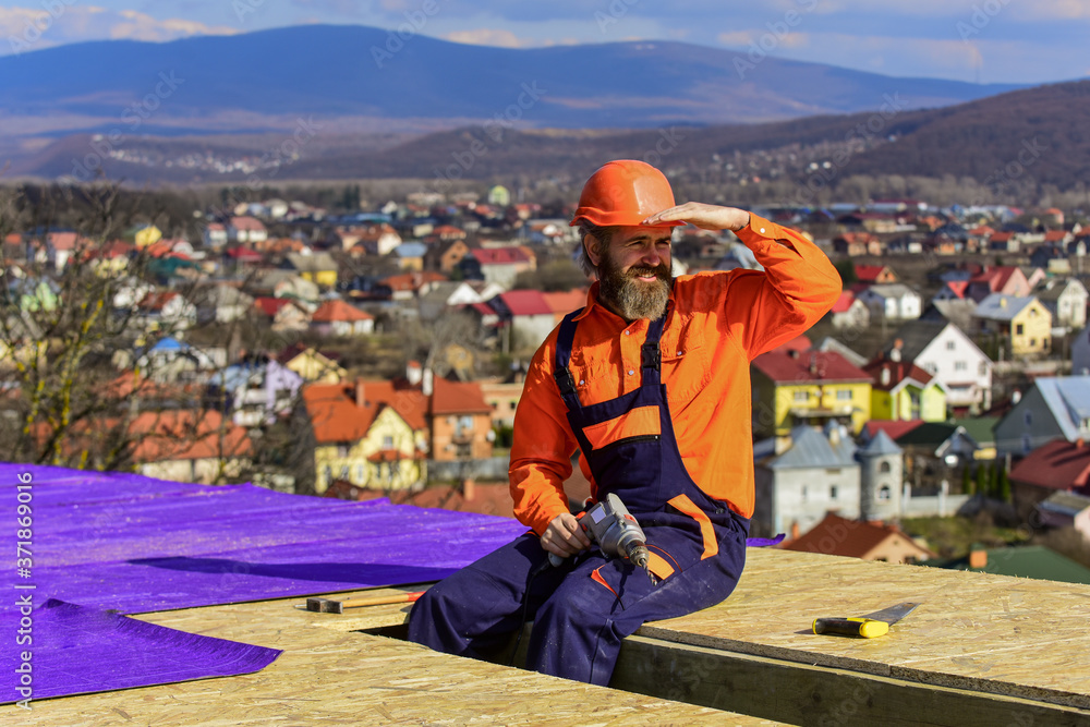 Roofer constructing roof. Master repair roof. Flat roof installation ...