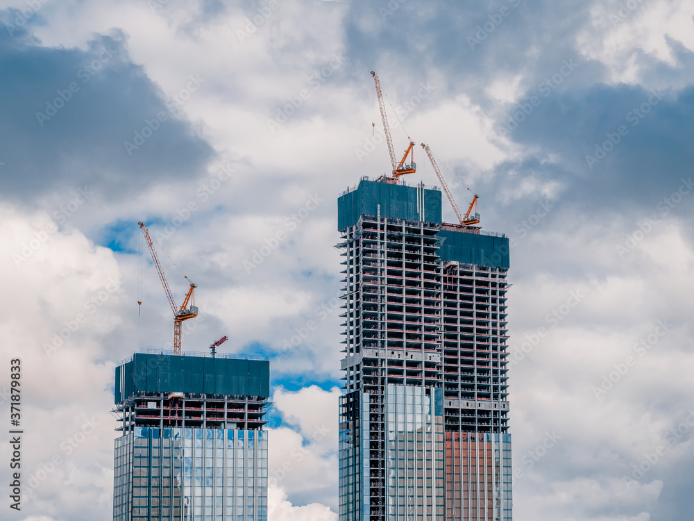 Construction work site and high rise building. High-rise building under ...