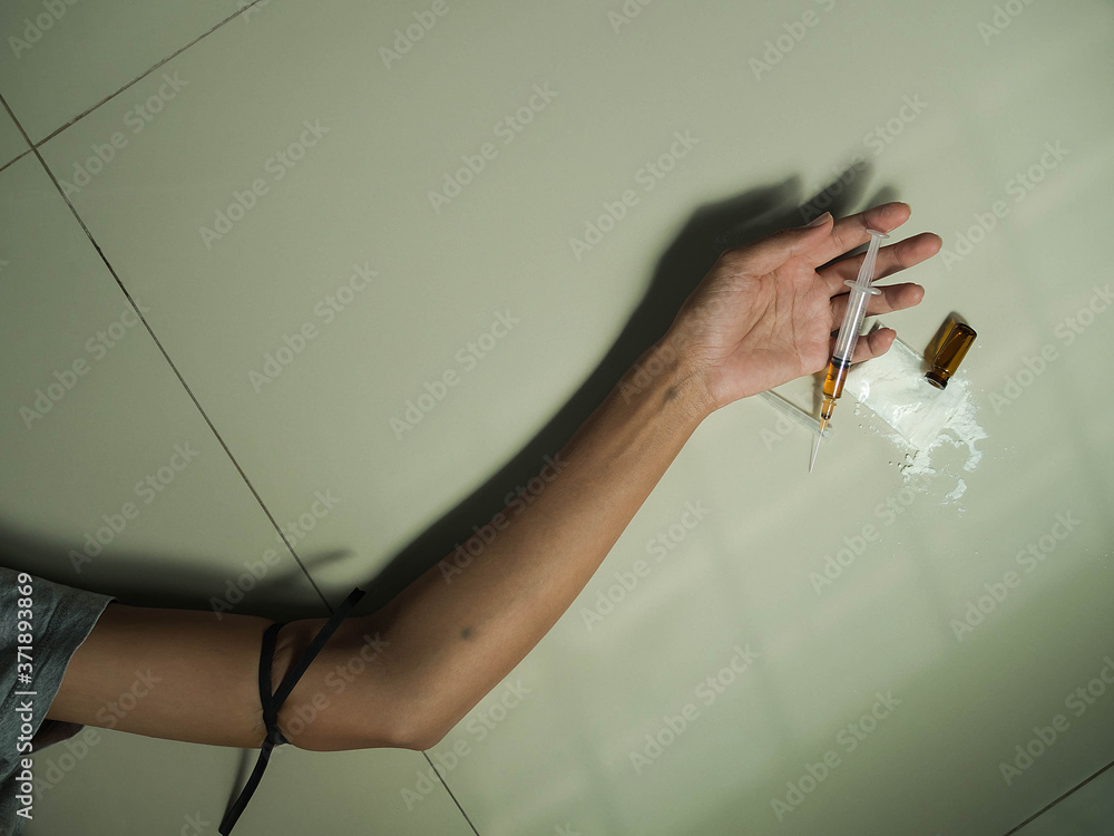 Heroin, injection needle with hand asian women. heroin is hard drugs ...
