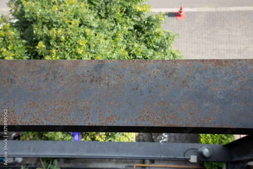 Top view and close shot of rusted metal beam installed at high level ...