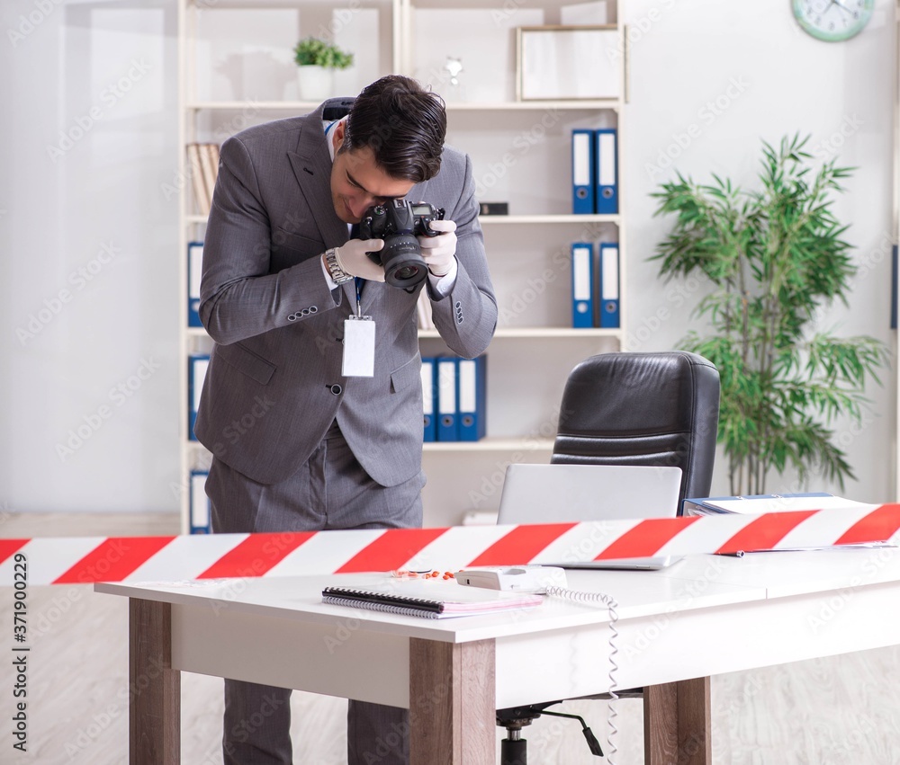 Forensics investigator at the scene of office crime Stock Photo | Adobe ...