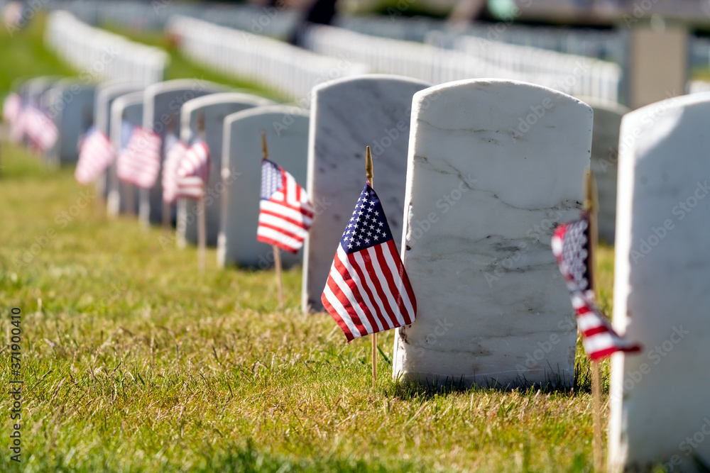 Memorial Day flag at headstones at National Cemetery Stock Photo ...