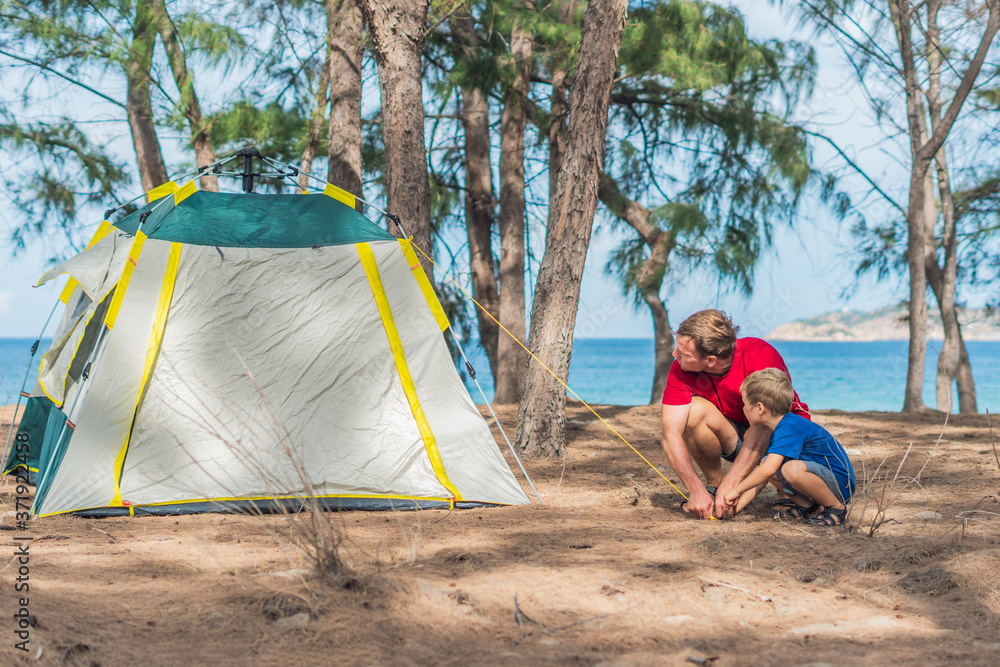 Camping people outdoor lifestyle tourists put up set up green grey ...