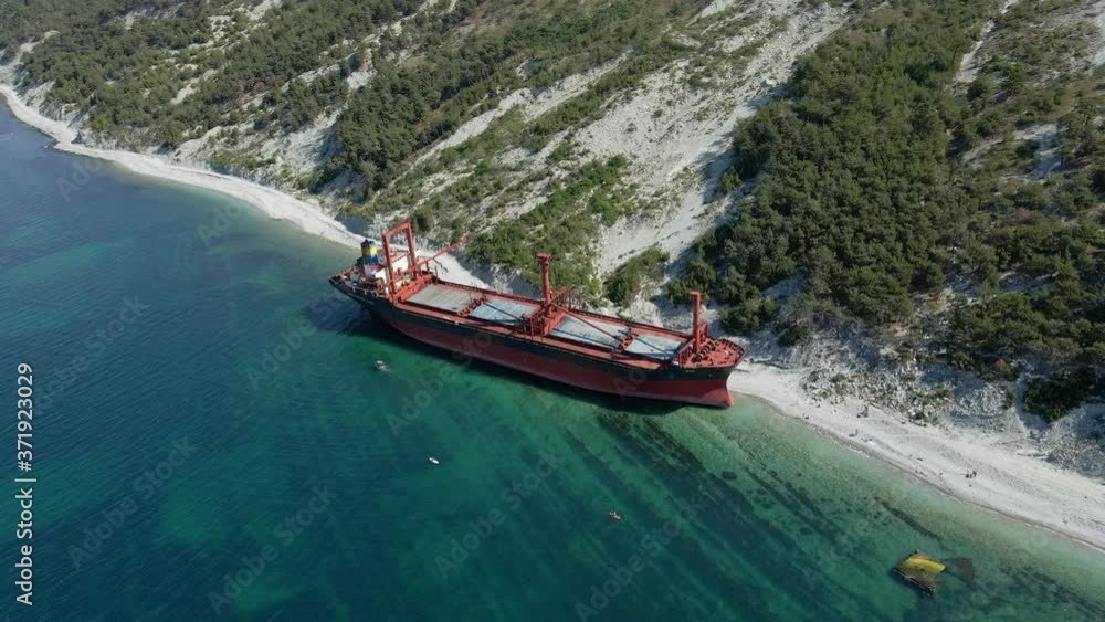 cargo ship that ran aground ran aground on the coast of the sea Stock ...