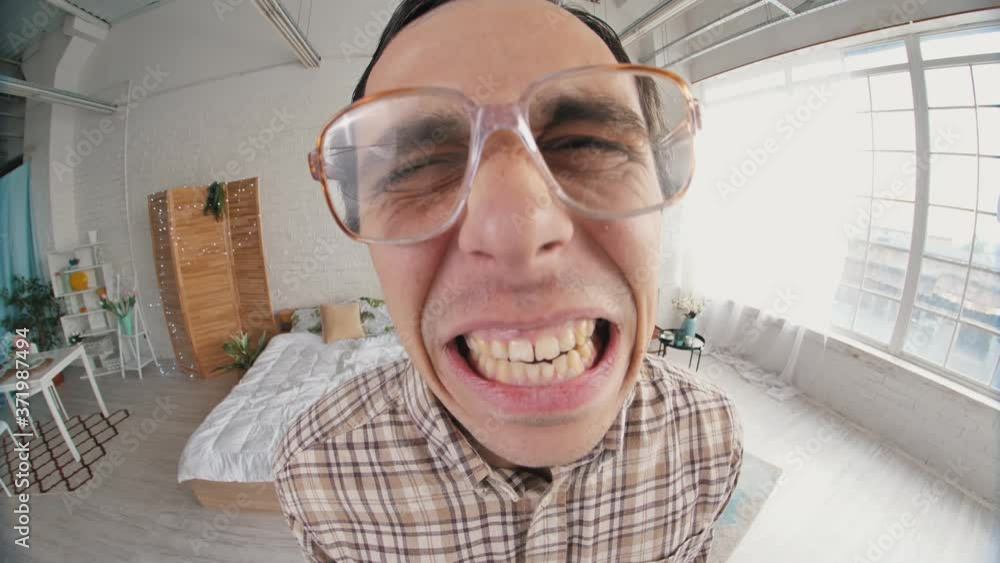 Tired nerd yawning at home Stock Video | Adobe Stock