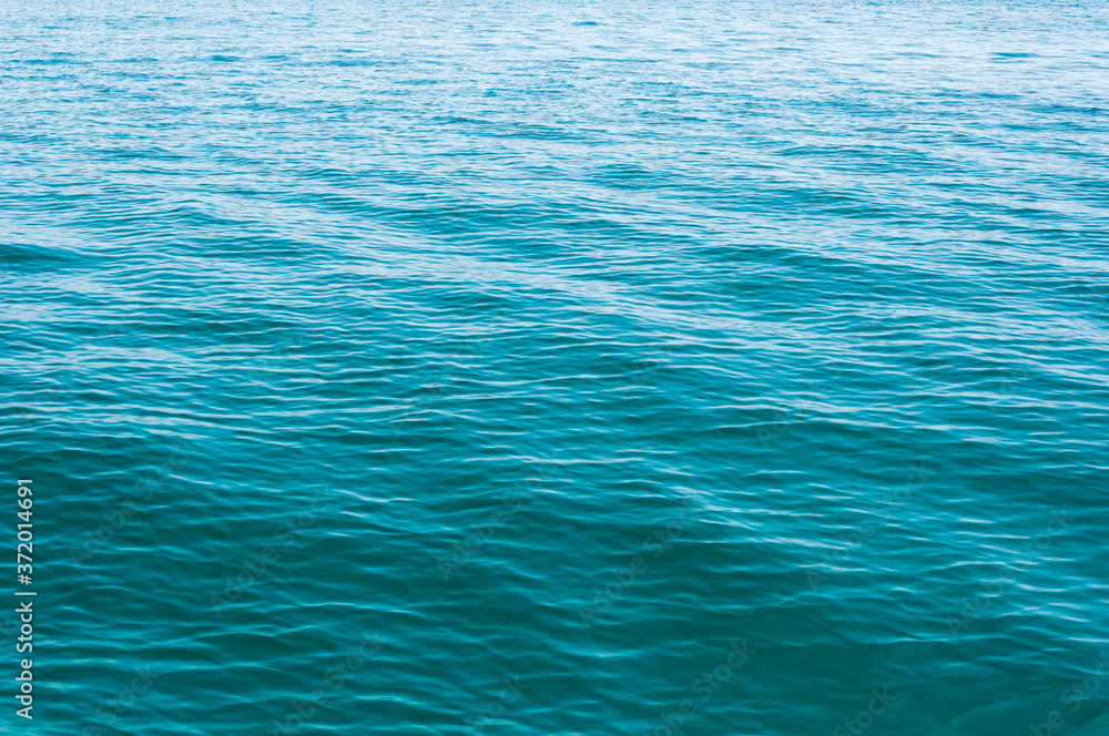 Blurred image of sea water texture in movement. Deep blue and light ...