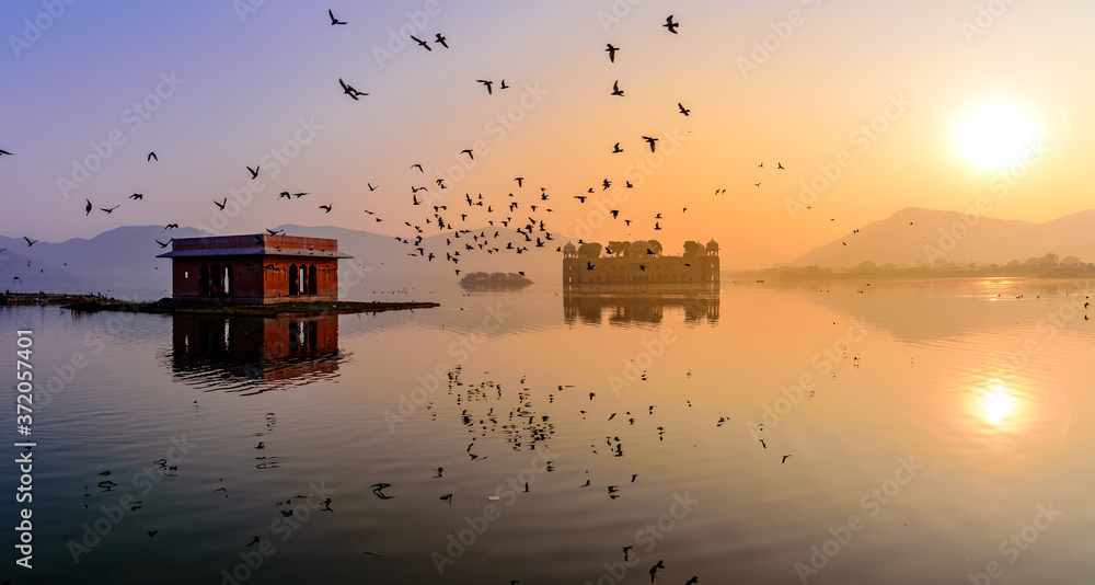 Panoramic view during Sunrise at the Jal Mahal 'Water Palace'. It is an ...
