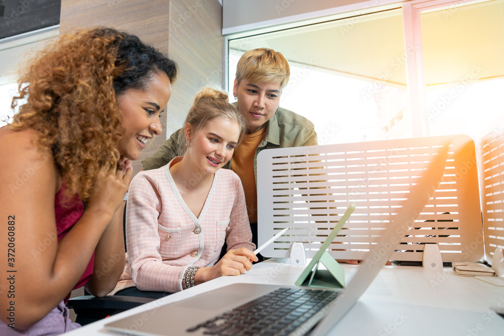 Successful diverse team consulting with colleague at workplace. Group ...