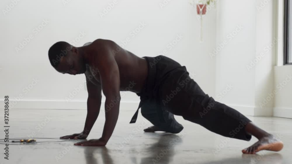African American black male wearing black karate pants, shirtless ...