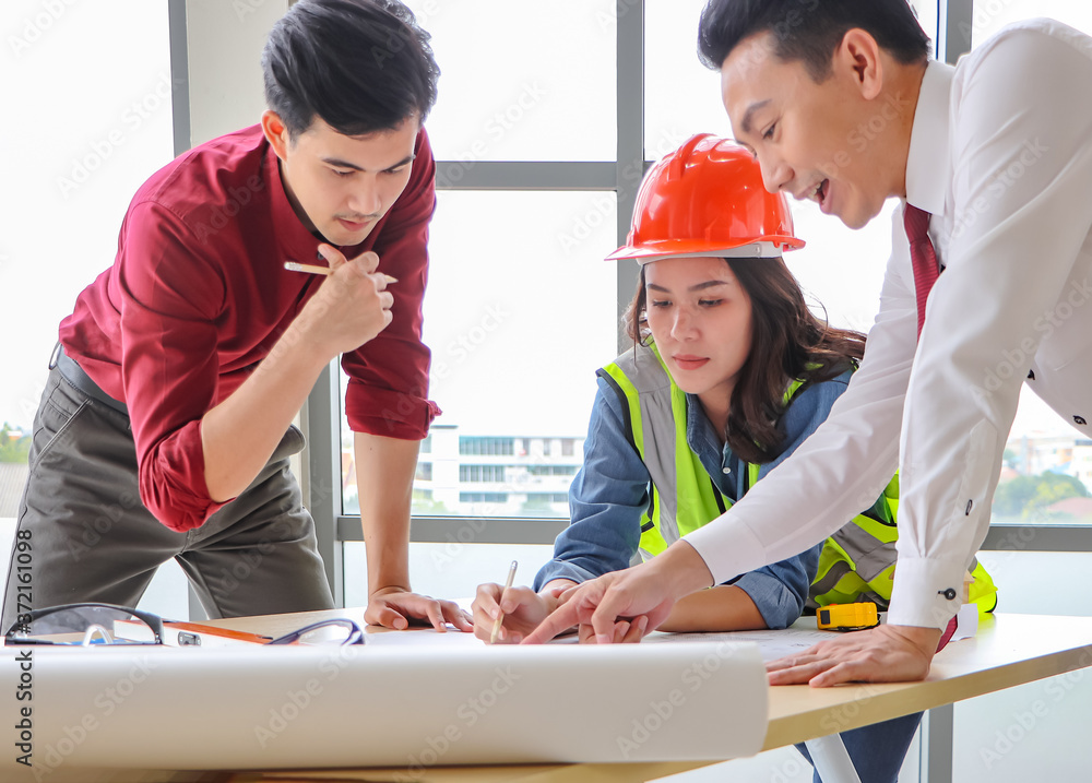 construction workers , a female architect and two male engineers ...